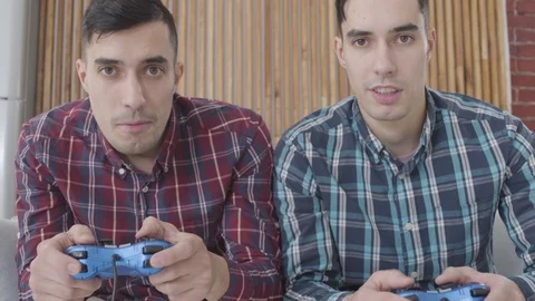 Close-up of two identical twin brothers ... | Stock Video | Pond5