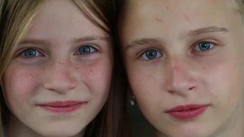 Close up two young girl face, portrait c... | Stock Video | Pond5