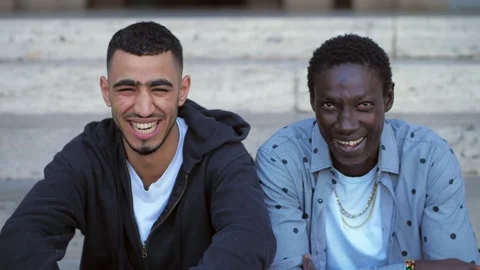 Close up two young laughing men in stree... | Stock Video | Pond5