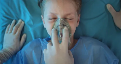 Close up of unconscious child with oxyge... | Stock Video | Pond5