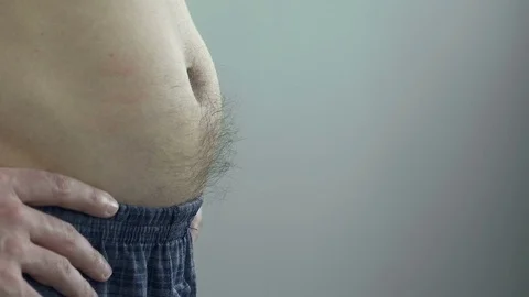 Close up of untidy-looking male scratchi... | Stock Video | Pond5