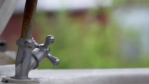 Close up use an old rusty faucet in the ... | Stock Video | Pond5