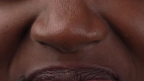 Close up view of a black woman nose. Wri... | Stock Video | Pond5