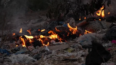 Close up view of burning plastic waste c... | Stock Video | Pond5