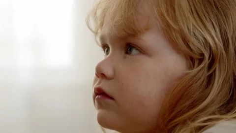 close up view of child watching TV and o... | Stock Video | Pond5