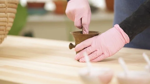 Close-up view of a copper mortar with pe... | Stock Video | Pond5