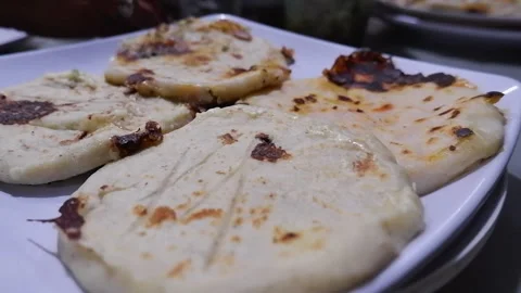 Close up view of delicious pupusas on pl... | Stock Video | Pond5