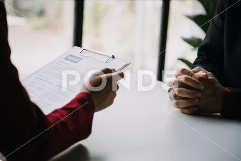 Close up view of job interview in office, focus on resume writing tips ...