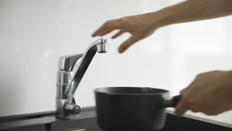 Close view of male hands turning on fauc... | Stock Video | Pond5