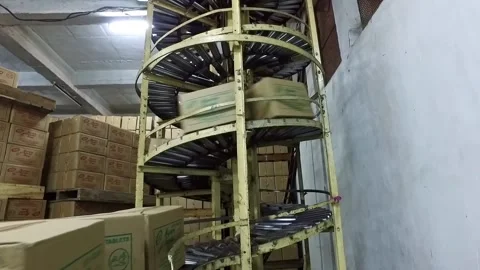 A close view of packed boxes rolling dow... | Stock Video | Pond5