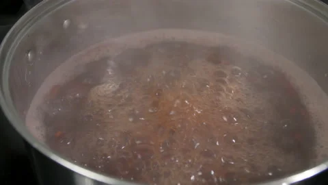 Close up view of peas boiling in a pot | Stock Video | Pond5