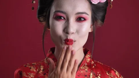Close-up view of smiling geisha woman in... | Stock Video | Pond5