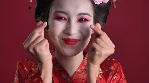 Close-up view of smiling geisha woman in... | Stock Video | Pond5