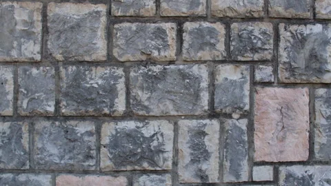 Close-up view of a stone wall reveals in... | Stock Video | Pond5