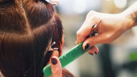 Close up view of stylist cutting hair. C... | Stock Video | Pond5