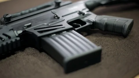 Close-up view of tactical gun on the tab... | Stock Video | Pond5