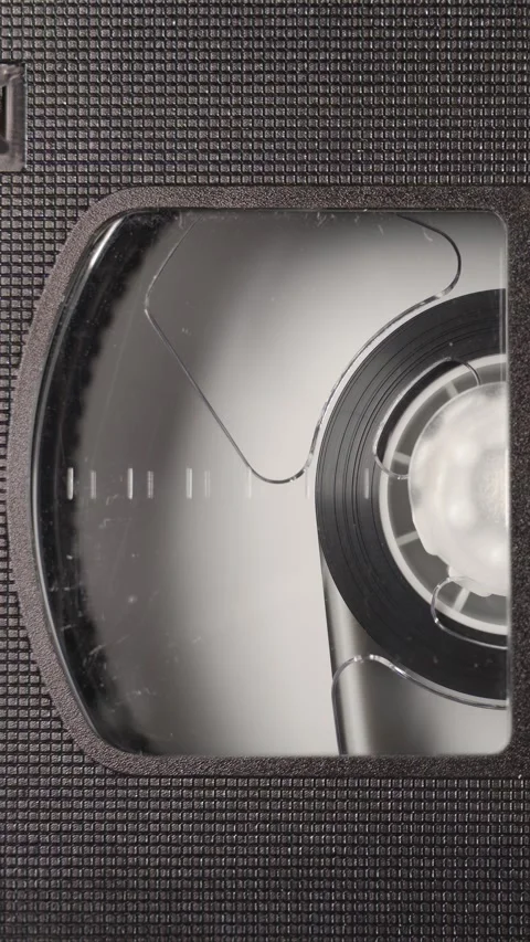 Close up view of a VHS Tape into a VCR P... | Stock Video | Pond5
