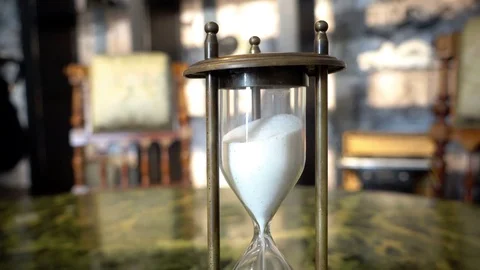 Close up vintage sand clock on wooden ta... | Stock Video | Pond5