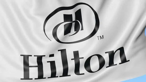 Close-up of waving flag with Hilton Hote... | Stock Video | Pond5