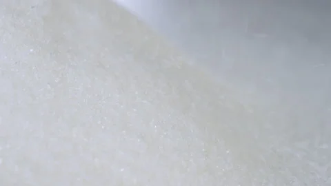 Close-up of white granulated sugar falli... | Stock Video | Pond5