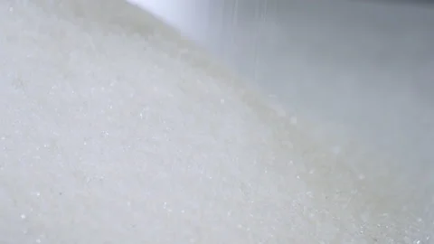 Close-up of white granulated sugar falli... | Stock Video | Pond5