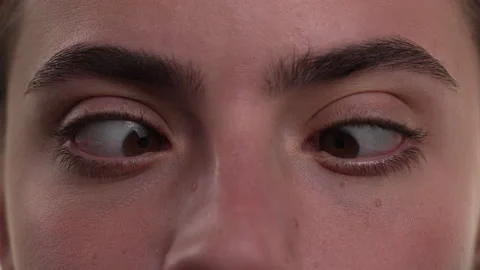 Close up of a white woman eyes crossing ... | Stock Video | Pond5