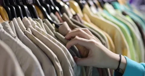 Close up woman hand choosing cloth and d... | Stock Video | Pond5