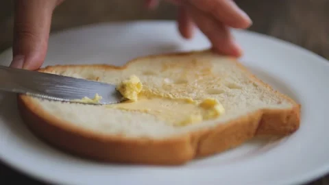 Close up of woman hands spreading butter... | Stock Video | Pond5