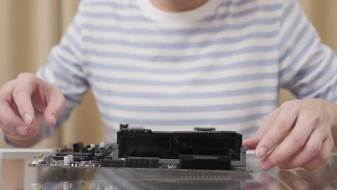 Close-up of a woman removing RAM from a ... | Stock Video | Pond5