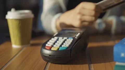 Close-up of woman rotating credit card i... | Stock Video | Pond5