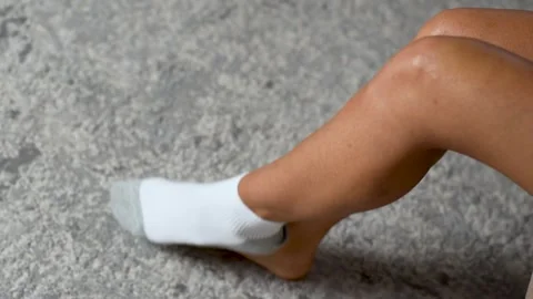 Woman Taking Off Socks Stock Videos – Royalty-Free HD & 4K Videos