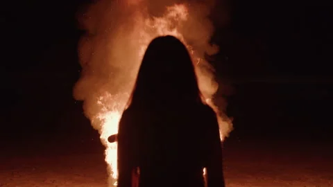 Close Up Of Woman Watching Object Burn | Stock Video | Pond5