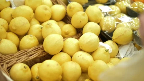 close-up. Woman's hand picking a lemon o... | Stock Video | Pond5