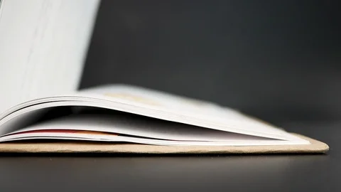 Close up of Woman's hand turning pages o... | Stock Video | Pond5