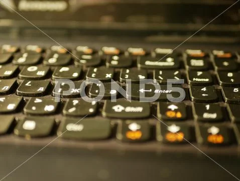 Photograph: Close-Up of Worn Laptop Keyboard with Cyrillic Layout ...