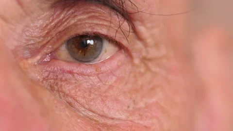 Close-up of the wrinkled eye of an elder... | Stock Video | Pond5