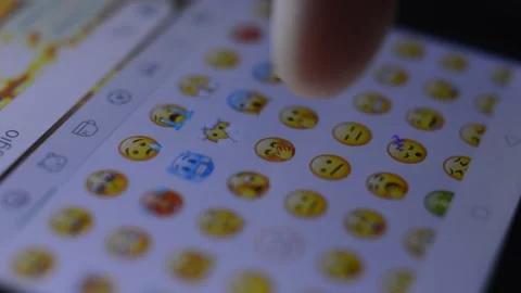 close-up yellow emoticon face on the pho... | Stock Video | Pond5