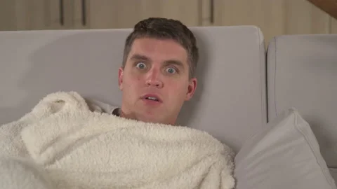 CLOSE UP Young guy being afraid while wa... | Stock Video | Pond5