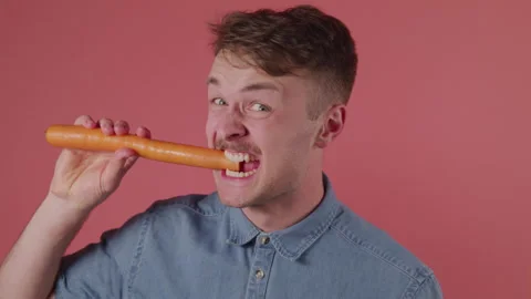 Close up of a Young Man Chomping Down on... | Stock Video | Pond5