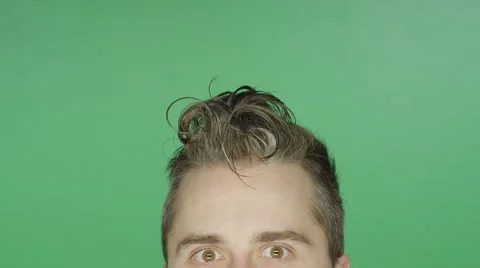 Close up of a young man with crazy eyes ... | Stock Video | Pond5