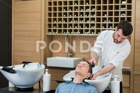 Close-Up Of A Young Man Having His Hair Washed In Hairdressing Salon ...