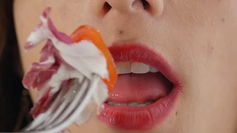 close-up of a young woman's mouth eating... | Stock Video | Pond5