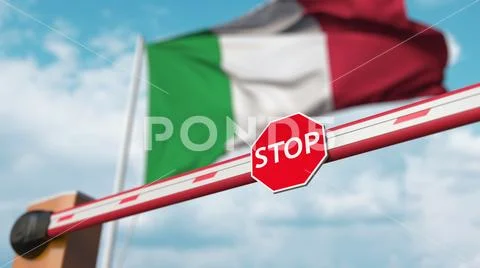 Closed boom barrier with stop sign against the Italian flag. Restricted ...