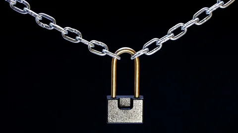 A closed lock with a steel chain hanging... | Stock Video | Pond5