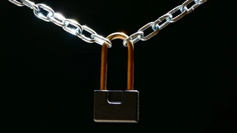 A closed lock with a steel chain hanging... | Stock Video | Pond5