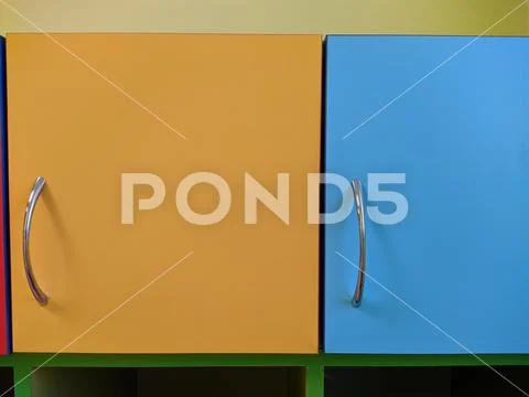 Photograph: Closed wooden colored cabinets close up photo #151932062