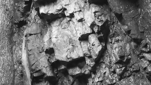 Closer look of the black granite rocks i... | Stock Video | Pond5