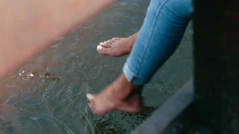Closeup of a barefoot person dipping the... | Stock Video | Pond5