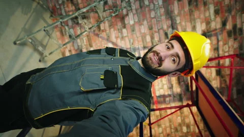 Closeup to the camera builder man at con... | Stock Video | Pond5