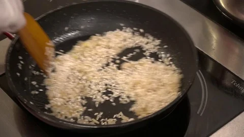 Closeup of chef's hands stirring rice on... | Stock Video | Pond5